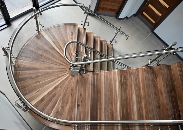New office block build with central stainless steel and glass staircase